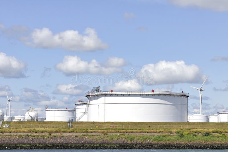 Oil Depot with Storage Tanks and Wind Turbine Stock Photo - Image of ...