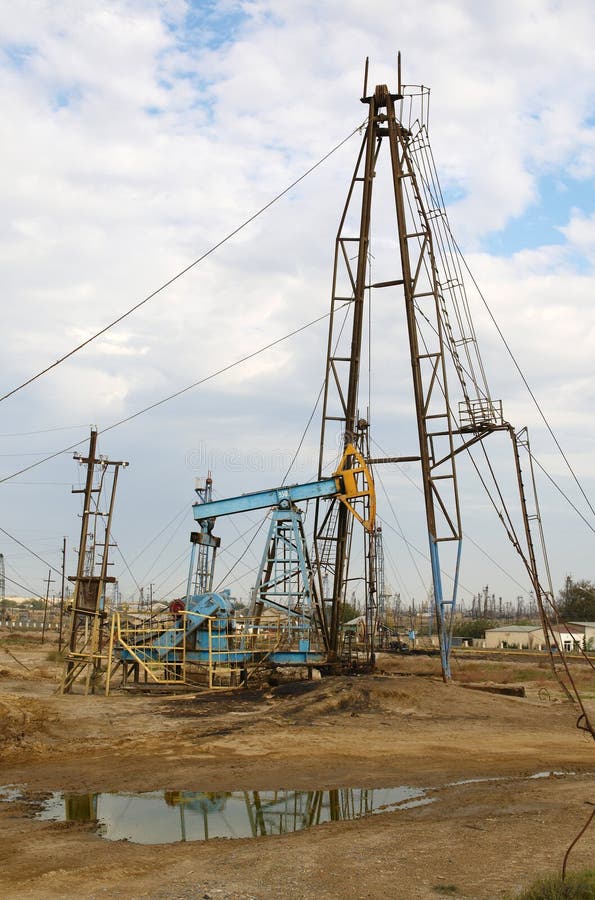 Oil derricks on the shore stock photo. Image of ecosystem - 7122802