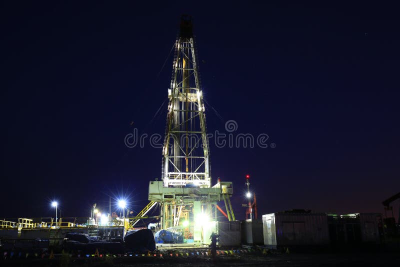 Oil Drilling Rig at Night stock photo. Image of monkey - 11700010