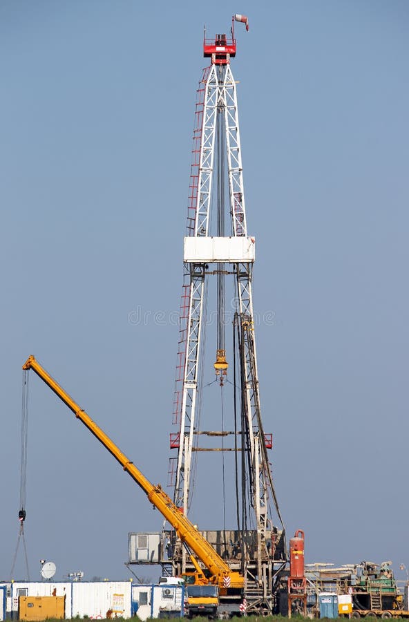 Oil drilling rig and crane stock image. Image of drilling - 74900363