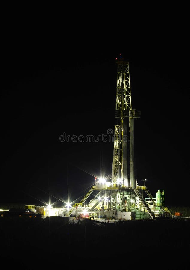 Oil Drilling Rig at Night stock photo. Image of monkey - 11700010