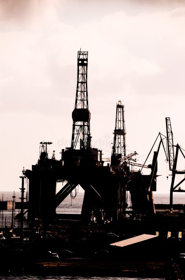 Oil Rig Silhouette Over Blue Sky Stock Image - Image of black ...