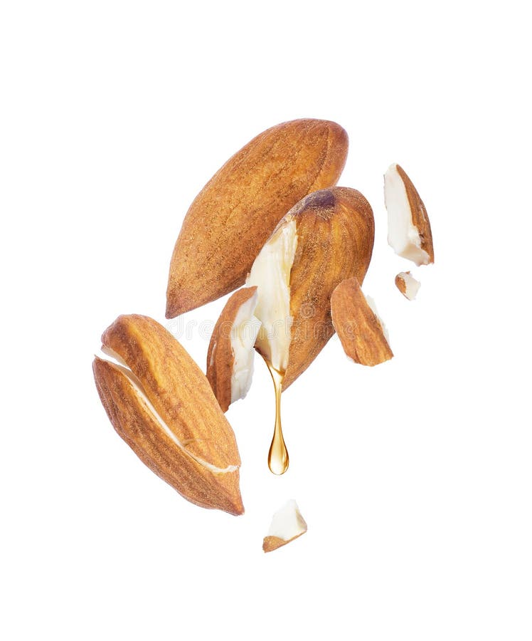 Oil Dripping from Almond Close-up on a White Background Stock Image ...