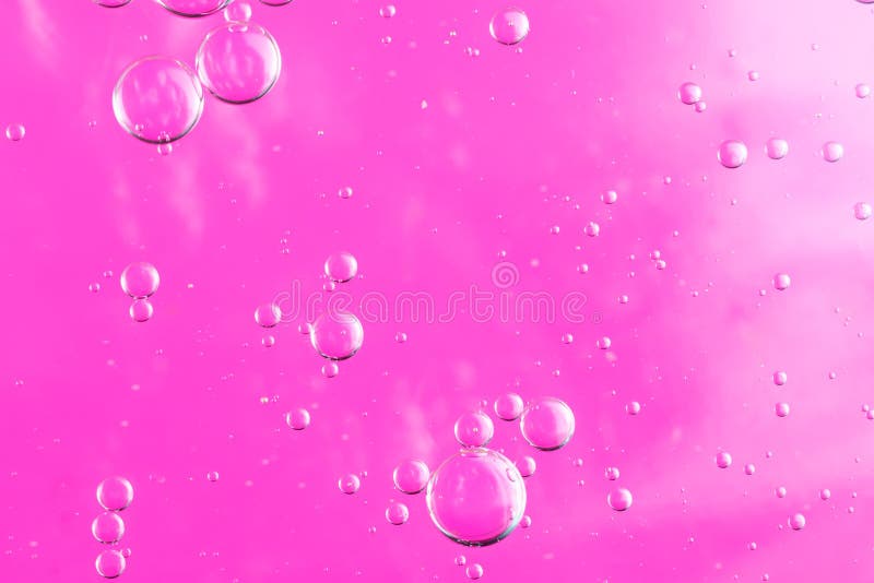 Oil Drops on Water on a Pink Background Stock Image - Image of concept ...