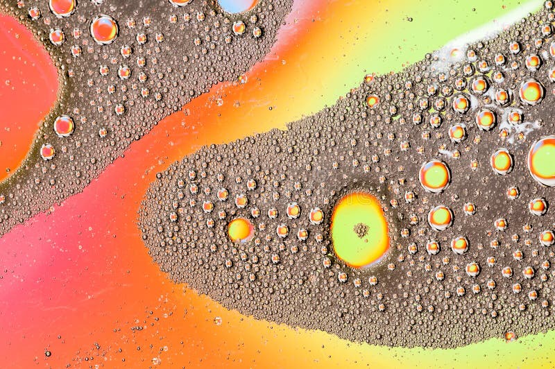 Oil drops on water surface stock photo. Image of cell - 56984592