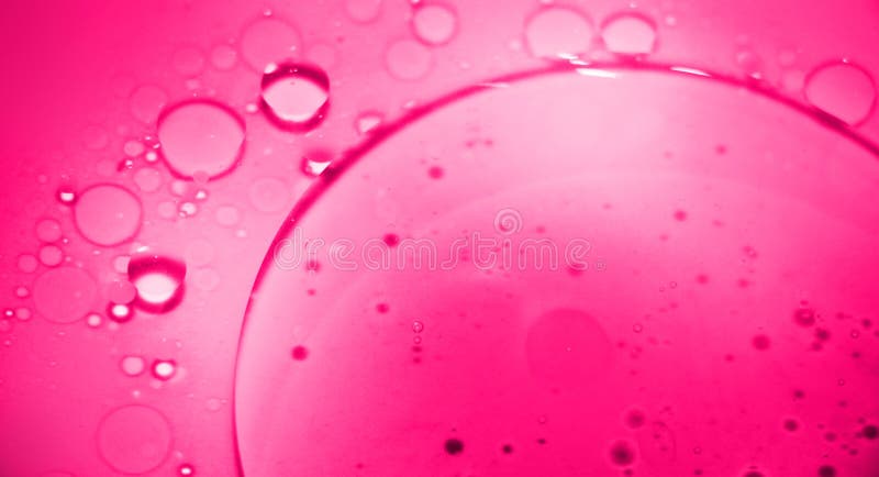 Oil Drops on a Water Surface in Pink Neon Light Stock Photo - Image of ...