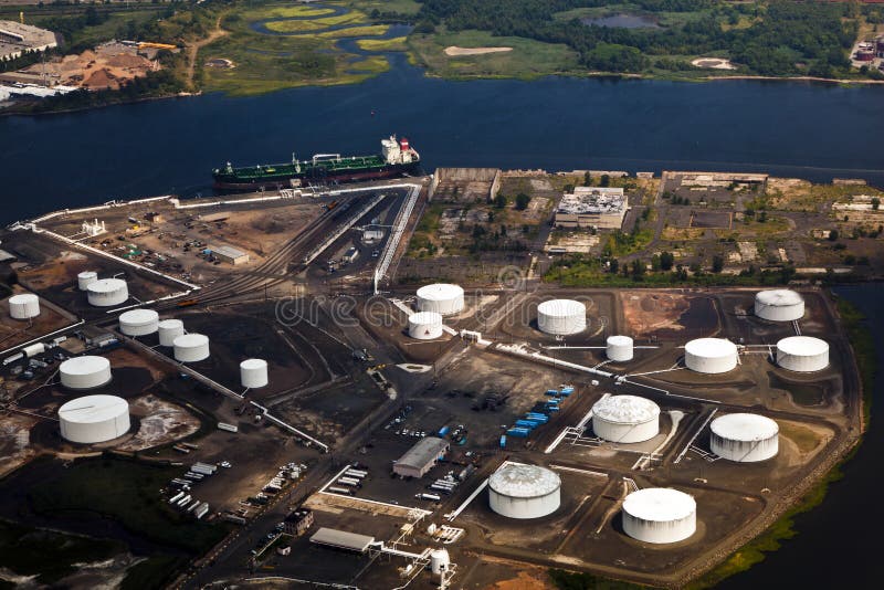 Oil farm with river stock image. Image of construction - 59247693