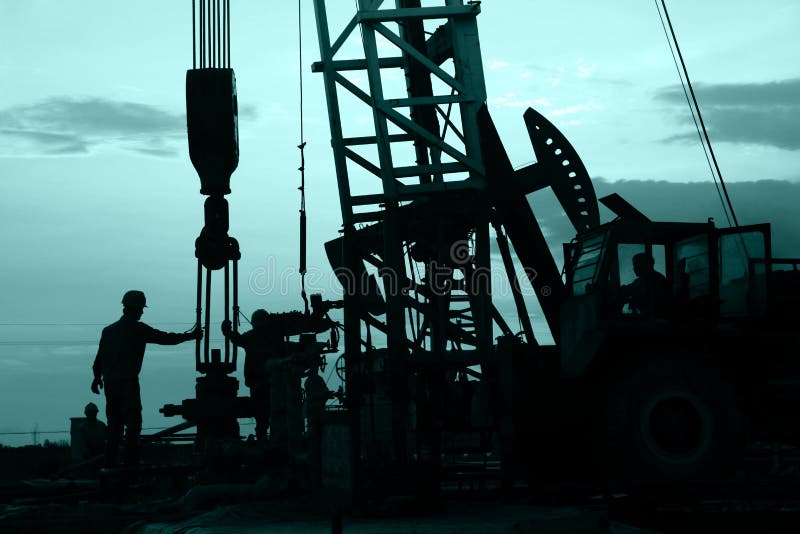 The Oil Workers are Working Stock Image - Image of evening, petroleum ...