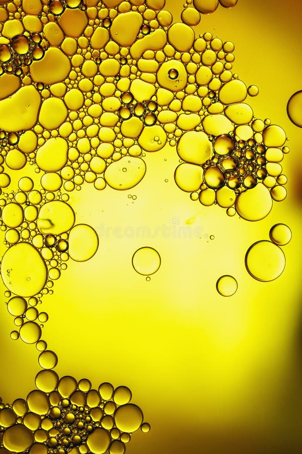 Oil Floating on Yellow Background Stock Image - Image of line ...