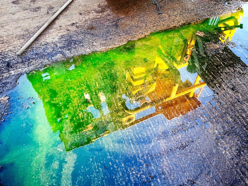 Puddle reflection stock photo. Image of industrial, metal - 111458996