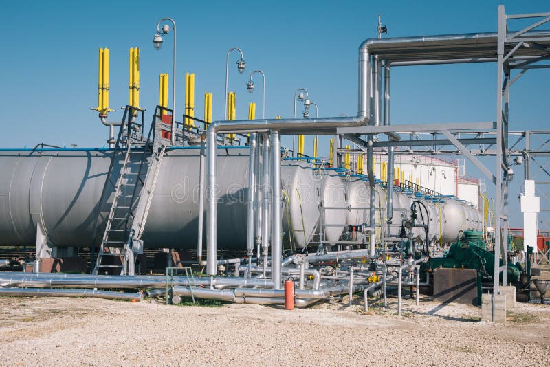 Oil and gas storage tanks stock image. Image of equipment - 39245235