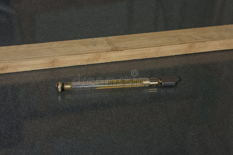 Oil Glass Cutter Close-up on Glass Surface Stock Image - Image of ...