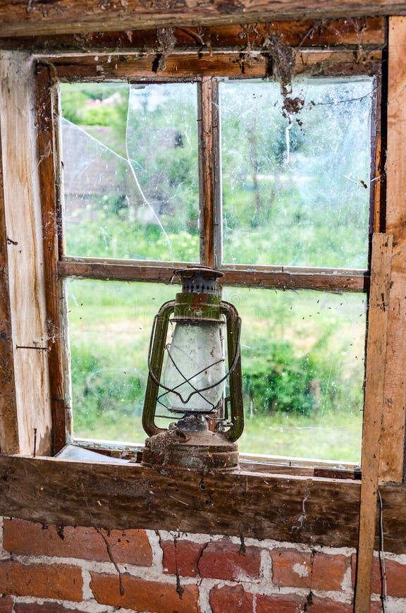Oil Lamp on Old Broken Window Stock Image - Image of glass, kerosene ...