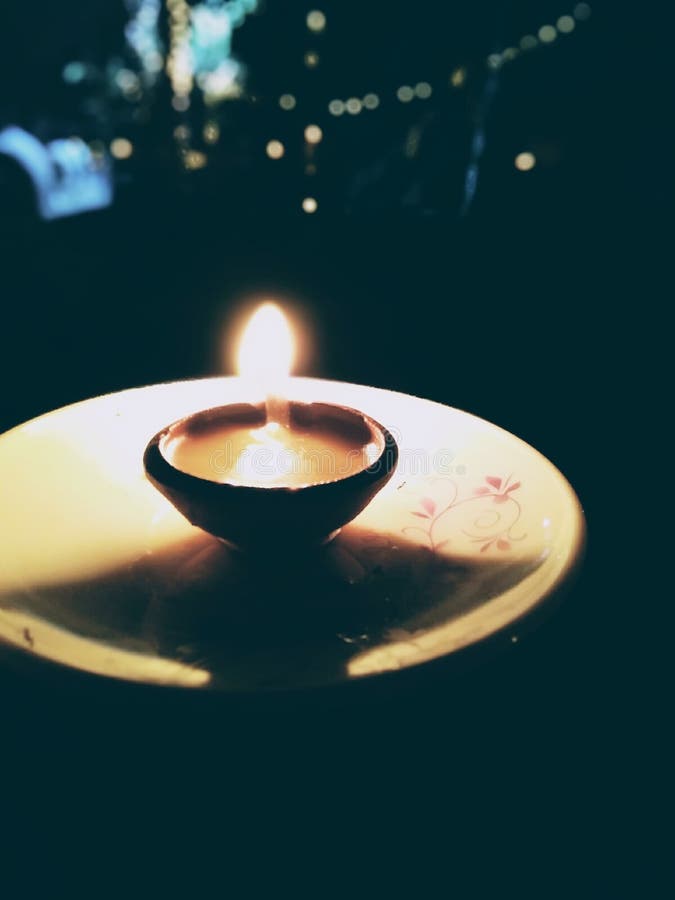 Oil lamp and plate stock image. Image of night, plate - 173835041