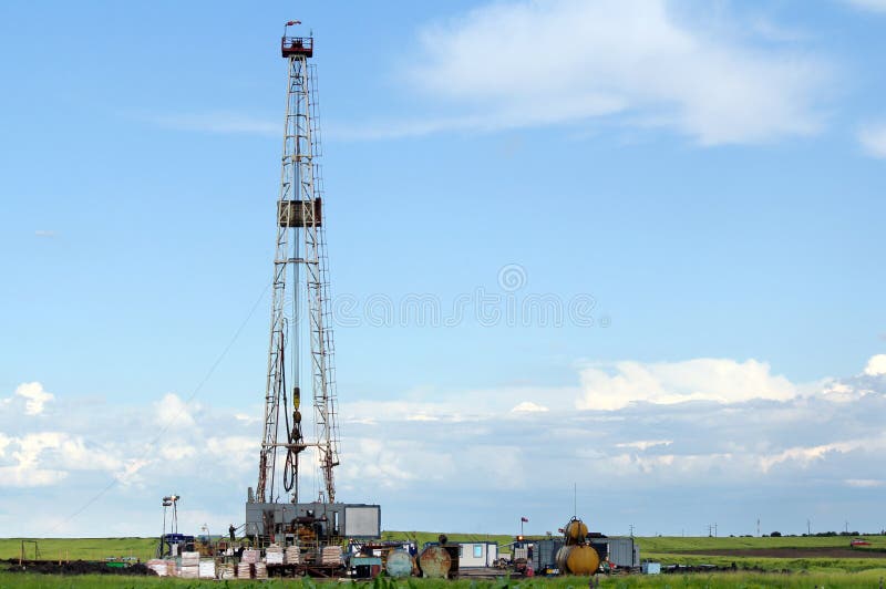 Land Oil Drilling Rig on Field Stock Photo - Image of large, cloud ...