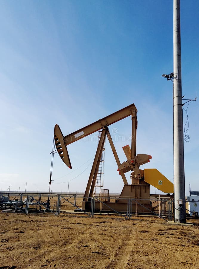 Oil machine rocking stock image. Image of oilfield, extraction - 152597607