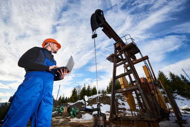 Oil Man Controlling Work of Petroleum Pump Jack. Stock Photo - Image of ...