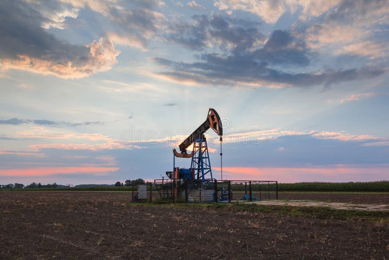 Oil mine at sunrise stock image. Image of dawn, natural - 146051243