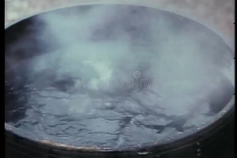 Oil Mixed in Water Boiling in a Cauldron Stock Footage - Video of ...