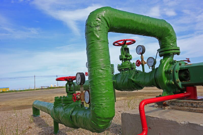 Oil pipes and valves stock photo. Image of electricity - 319189956