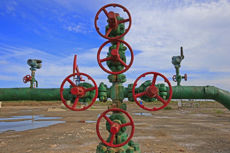 Oil pipes and valves stock image. Image of metal, pump - 371857983