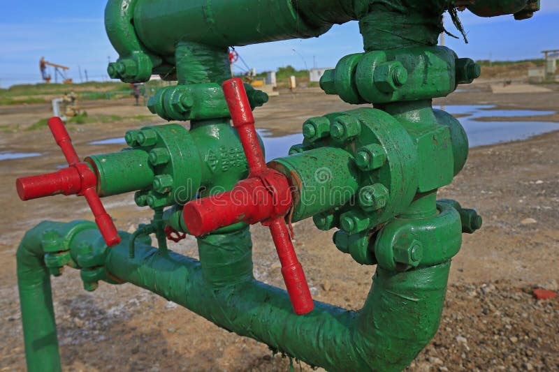 Oil pipes and valves stock photo. Image of plant, construction - 371858014