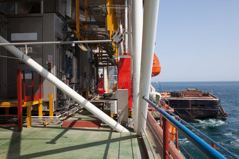 Oil Platform Constructions and Pipes Loading Ship Stock Image - Image ...