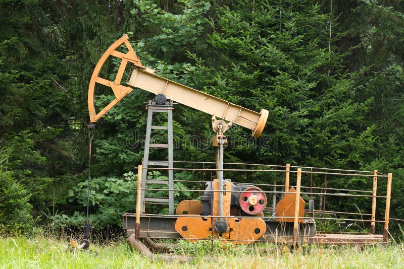 Oil pump in the forest stock image. Image of equipment - 72595337