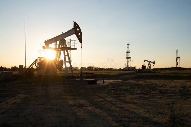 Oil Pump on orange sunset. stock image. Image of oilfield - 194455641