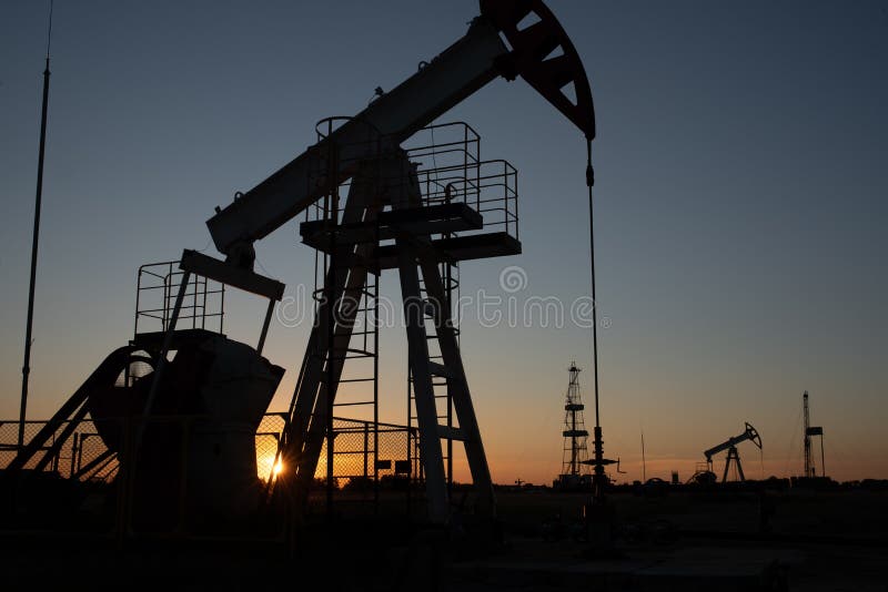 Oil Pump on orange sunset. stock image. Image of exploration - 194455799