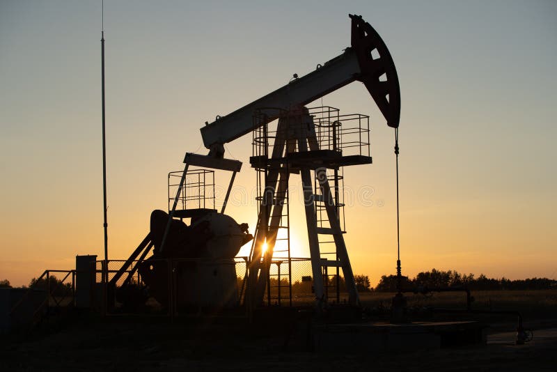 Oil Pump on orange sunset. stock photo. Image of sunset - 227523134