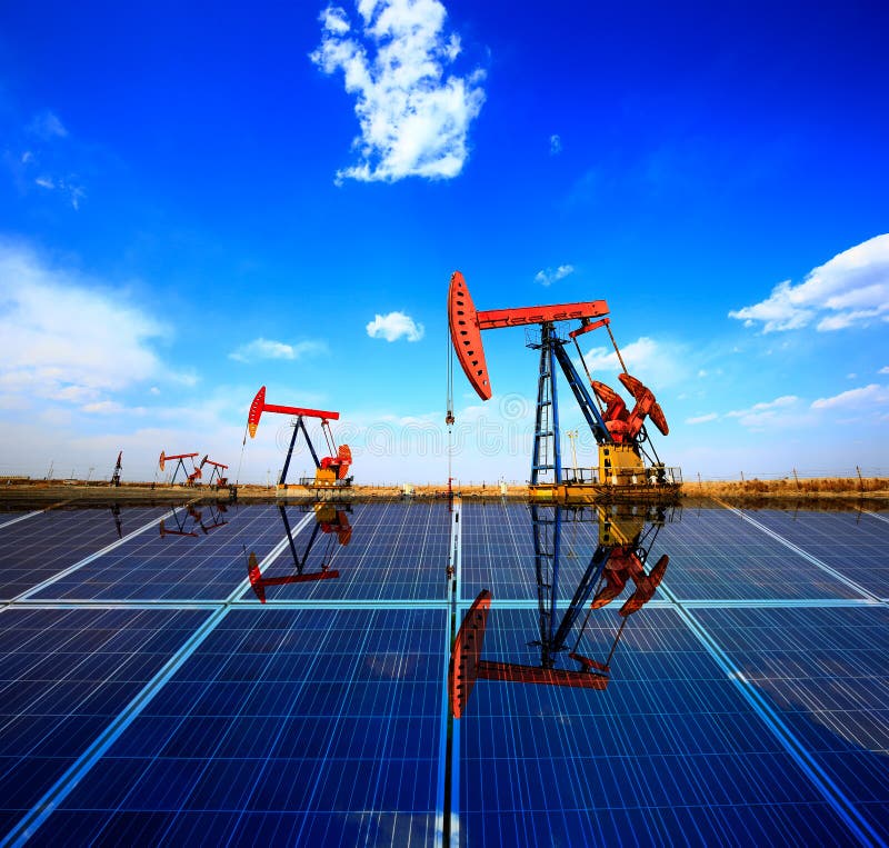 Oil pump with solar panels stock image. Image of renewable - 220042825