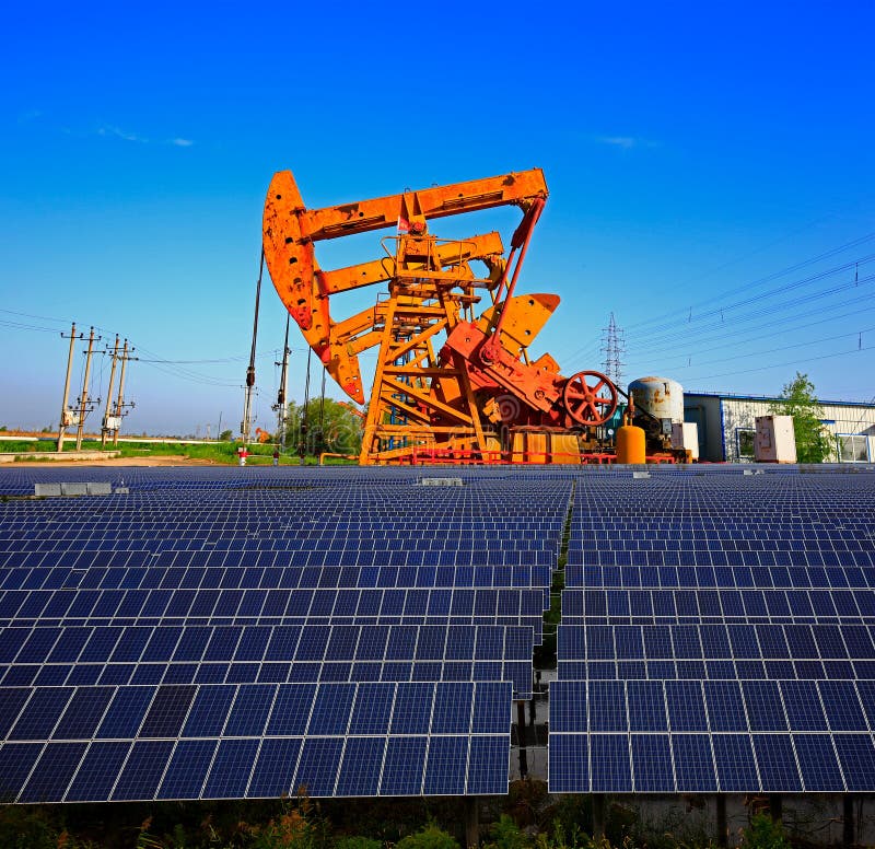 Oil pump with solar panels stock image. Image of industry - 222238625