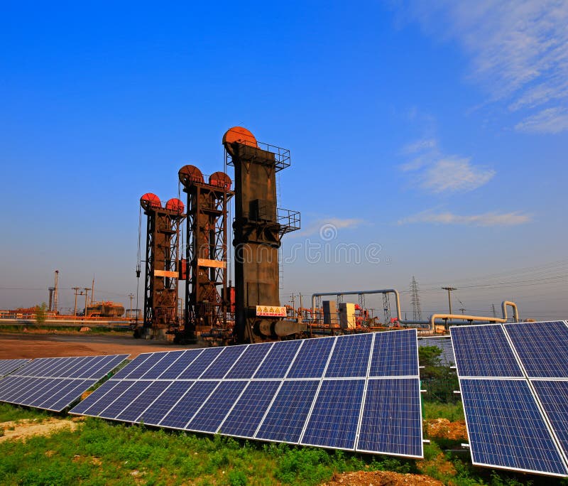 Oil pump with solar panels stock image. Image of industry - 245490257