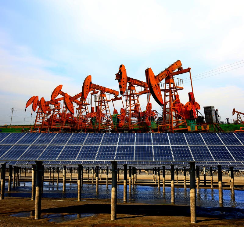 Oil pump with solar panels stock photo. Image of outline - 246007752