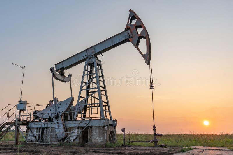 Oil pump at sunset stock photo. Image of fuel, drilling - 2223826
