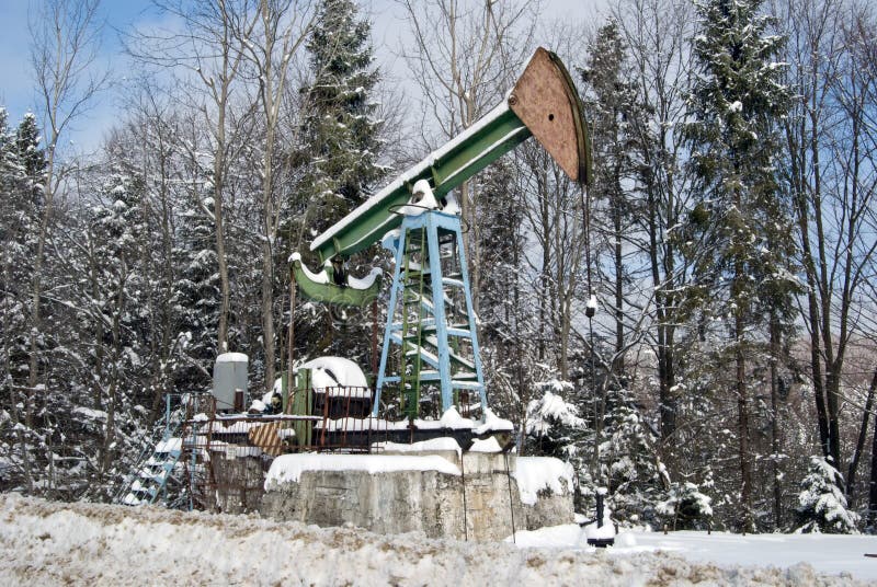 Oil pump in winter forest stock photo. Image of diesel - 22847700