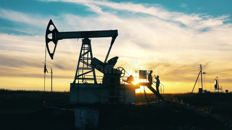Pumping Oil Rig at Sunset. Pump Jack Extracting Crude Oil from a Oil ...