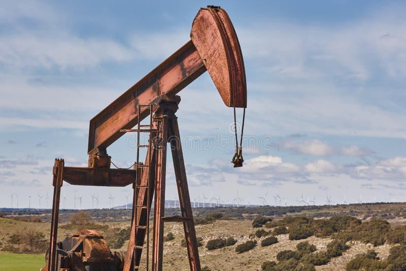 Oil Pumping Machine. Pump Jack and Windmills. Global Warming Stock ...