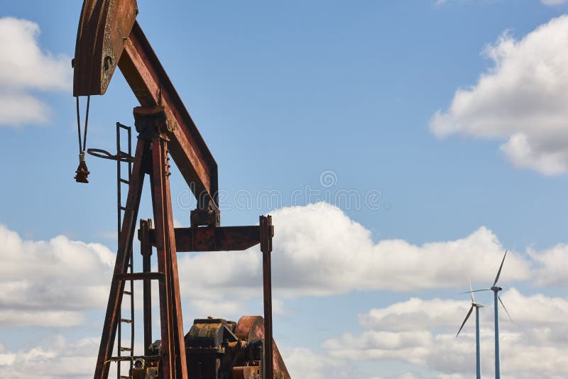 Oil Pumping Machine and Windmills. Petroleum Extraction. Global Warming ...