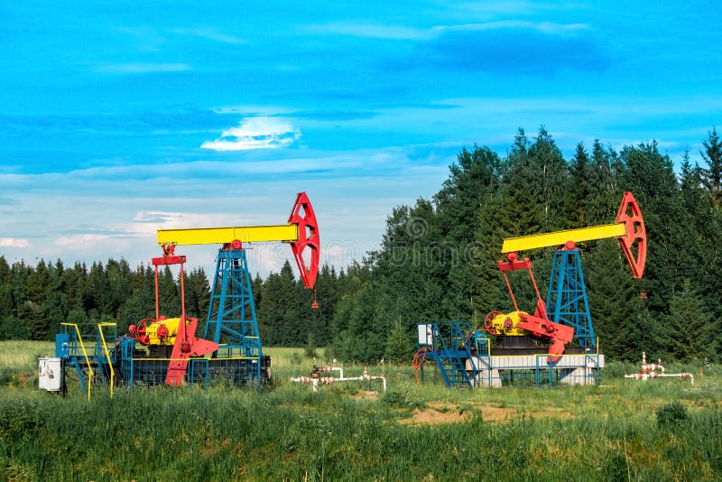 Oil Pumpjacks in a Clearing in the Forest Stock Image - Image of motor ...