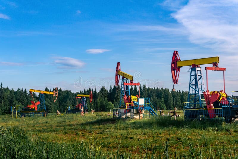 Oil Pumping Stations Pumpjacks in a Clearing in the Forest Stock Image ...