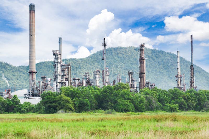 Oil Refinery with Green Field Stock Photo - Image of chimney, metal ...