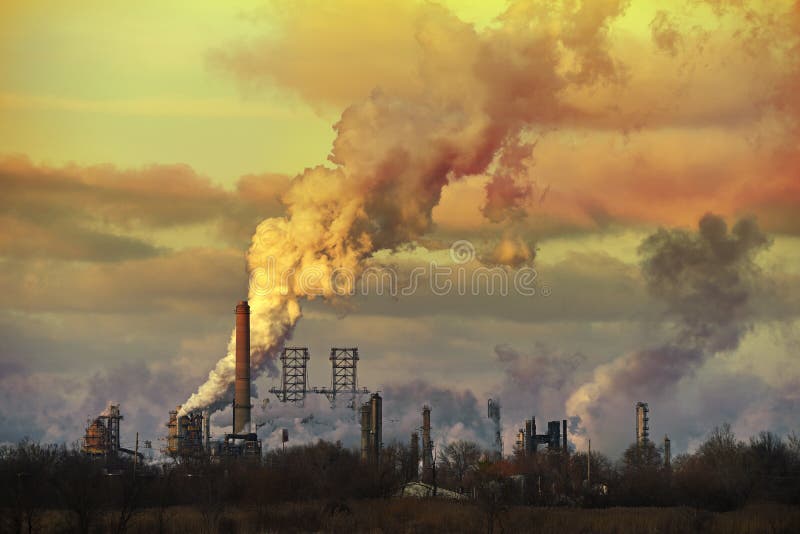 Oil Refinery Spewing Smoke at Sunset Stock Image - Image of stack ...