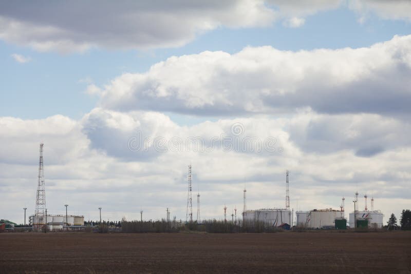 Oil Refinery with Oil Tanks on a Cloudy Summer Day Stock Photo - Image ...