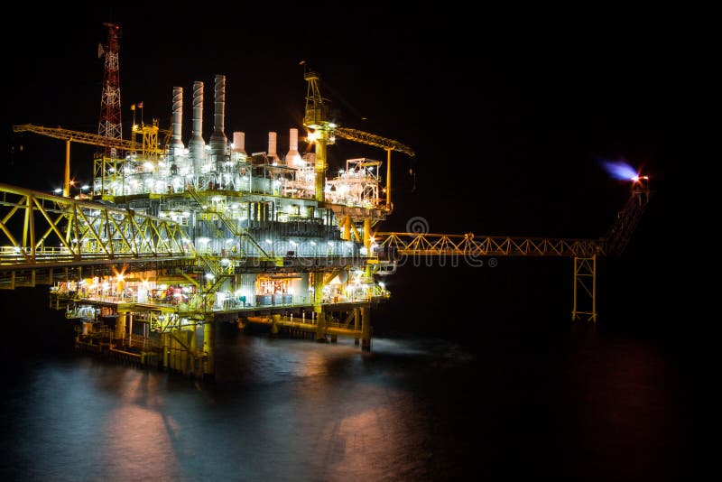 The Large Offshore Oil Rig Drilling Platform at Night Stock Photo ...