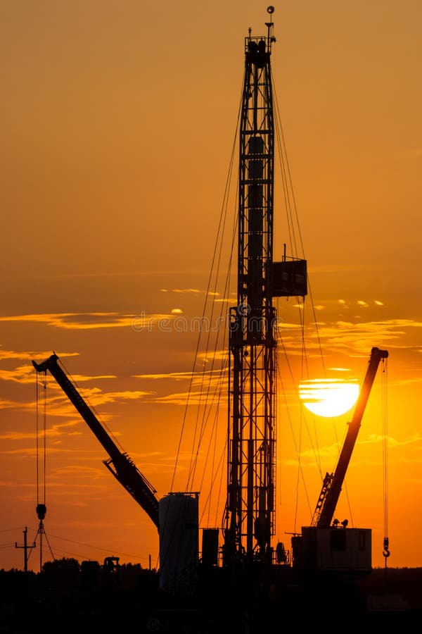 Sunset at drilling rig editorial photography. Image of sunrise - 53725352