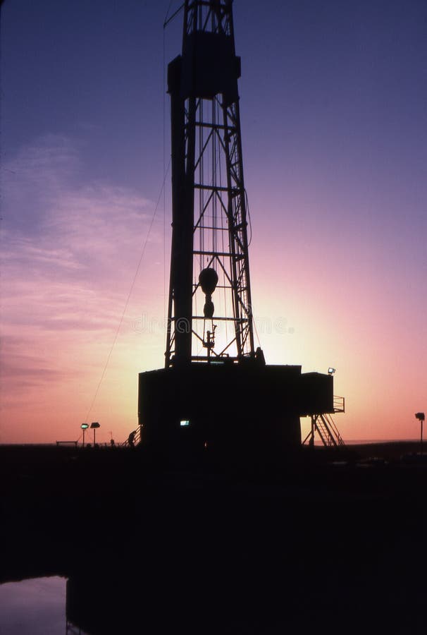 Oil rig at sunrise stock photo. Image of fossil, production - 7592634