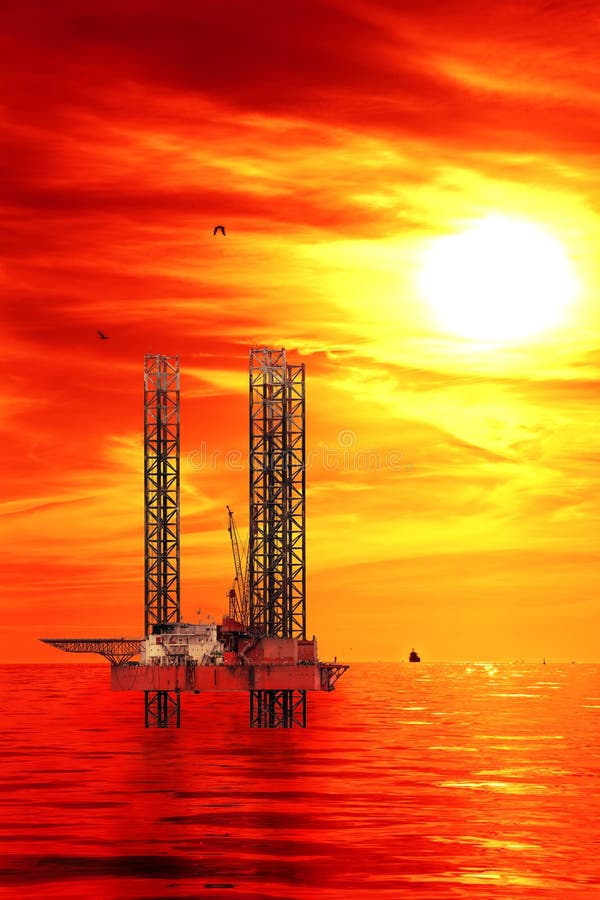 Oil Rig at sunrise stock photo. Image of beautiful, marine - 64074592