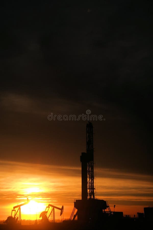 Oil rig in the sunset stock photo. Image of dusk, cloud - 51218014